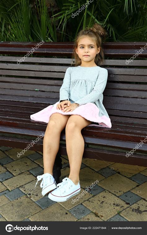A Girl Sitting On The Bench