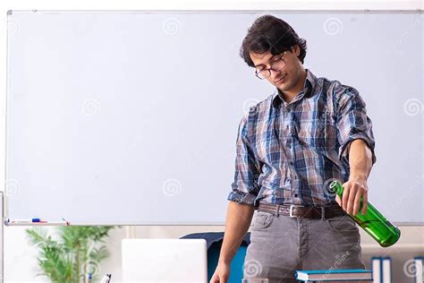 The Male Teacher Drinking In The Classroom Stock Image Image Of
