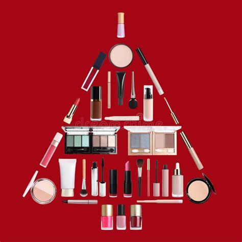 Christmas Tree Shape Made With Different Makeup Products On Red
