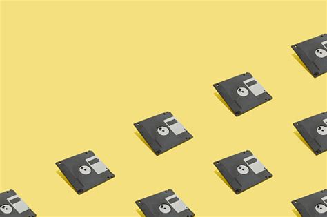 밝은 노란색 배경에 빈티지 플로피 디스크 드라이브로 만든 매끄러운 패턴 최소한의 추상적 인 개념 향수 80 년대와 90 년대