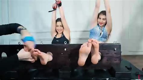 Two Girls Tickling In Stocks