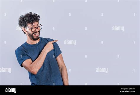 Handsome Man Pointing To The Side Smiling Guy Pointing His Fingers To The Side Latin Guy
