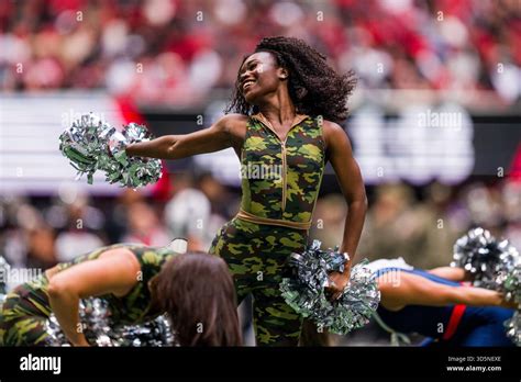 An Atlanta Falcons Cheerleader Performs During The First Half Of An Nfl