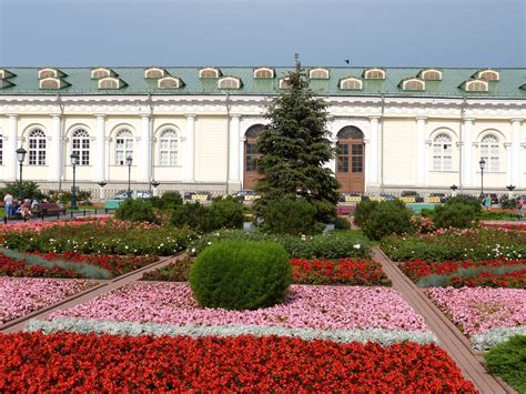2560x1440 Wallpaper Pink And Red Floral Garden Near White Concrete House Peakpx