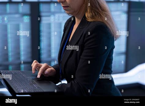 Software Developer In Data Center Checking Rigs And Hardware Doing Checkup Close Up Of