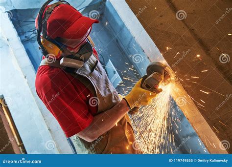 Home Renovation Worker Cutting Metal Reinforcement Rods In Doorway By
