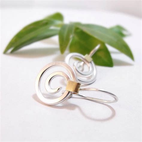 Sterling Silver Spiral Earrings With Brass Tab