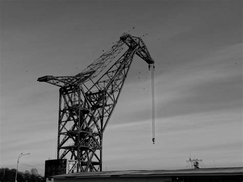 Premium Photo Low Angle View Of Crane At Construction Site Against Sky