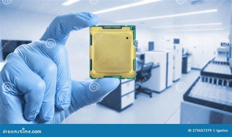 Laboratory Scientist Holds A Modern Microprocessor Chip In Hand