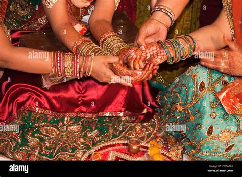 Women With Decorated Hands Bangles Holding Hands In A Hindu Religious
