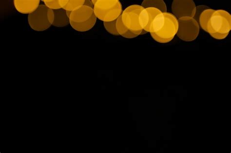 Premium Photo | Golden bokeh background blurred light overlay gold