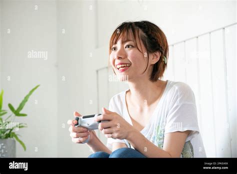 Woman With Game Controller Stock Photo Alamy