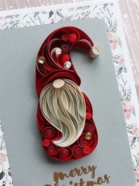 A Christmas Card With An Origami Santa Clause