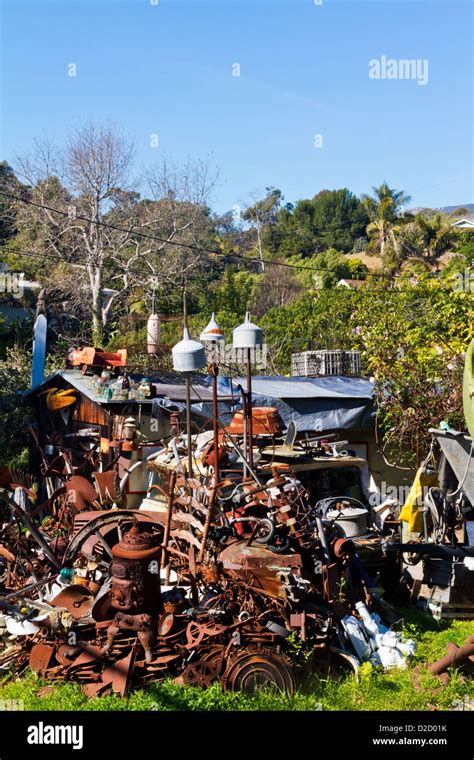 Junk Is Piled In A Front Yard Creating A Work Of Art In Summerland