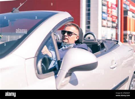 Stylish Man Sitting In Sport Car A Successful Businessman Rides An