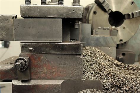Premium Photo A Lathe And Metal Chips In The Workshop