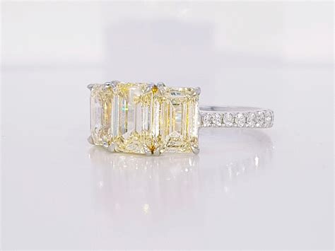 3 35 Carat Yellow Diamond Emerald Cut Three Stone Engagement Ring