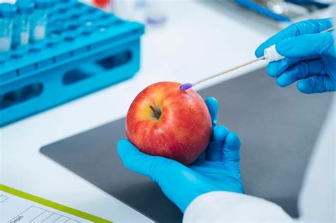 Premium Photo Food Safety Pesticide And Nitrate Testing Of Apples In Laboratory