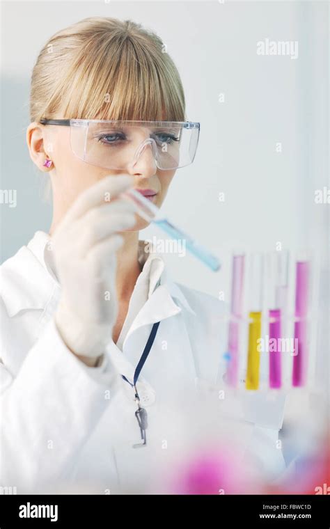 Female Researcher Holding Up A Test Tube In Lab Stock Photo Alamy