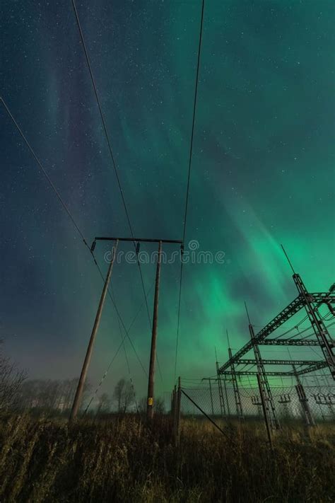 Beautiful Night Aurora Over Double Wooden Pole Power Lines And