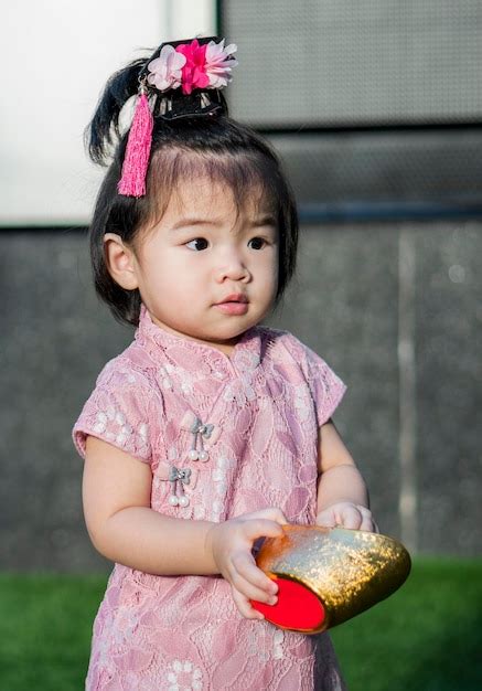 Premium Photo Cute Girl Holding Traditional Container