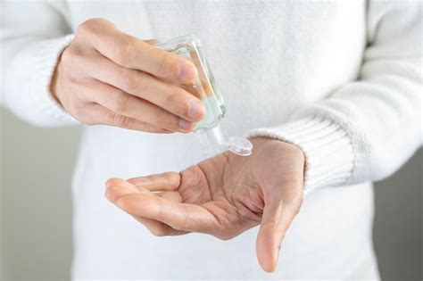 Premium Photo Female Hands Using Hand Sanitizer