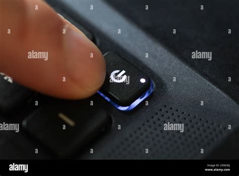 Closeup Of Finger Pushing Power On Button On Laptop Stock Photo Alamy