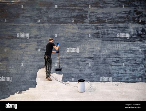 Construction Site Application Of A Bitumen Coating To A Concrete