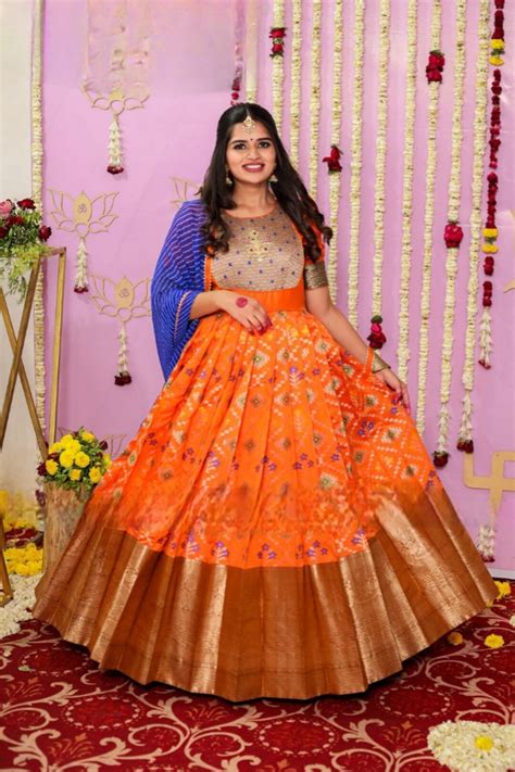 Festival Special Orange Color Pattu Gown With Blue Laheriya Style