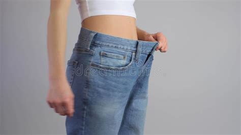 Slim Woman Taking Off Jeans From Hips Sensual Girl Take Off Pants