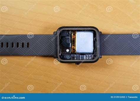 Disassembled Smartwatch Showing The Interior Battery Different Sensors And Cpu Stock Image