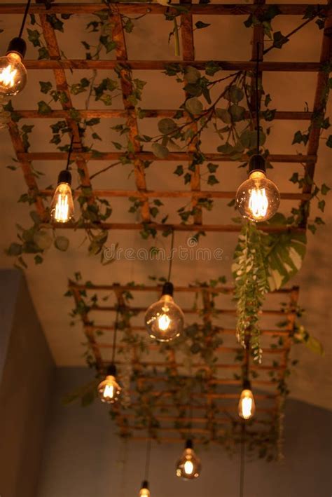 A Modern Lamp Made Of A Wooden Lattice Decorated With Plants Modern