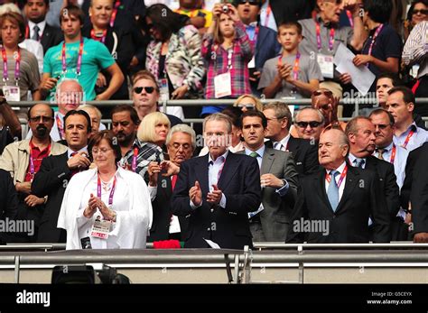 Ioc President Jacques Rogge Centre And Fifa President Sepp Blatter Right In The Stands To