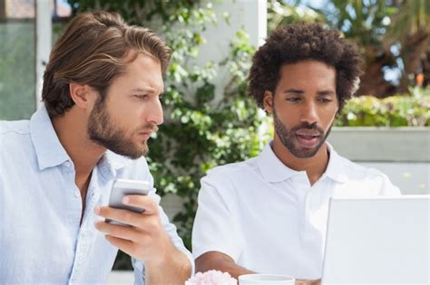 Premium Photo Two Friends Having Coffee Together With Laptop