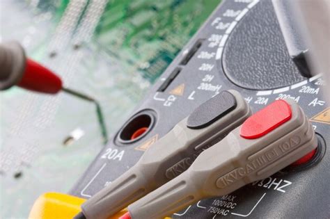 Premium Photo Close Up Of Digital Multimeter On Electronics Circuit
