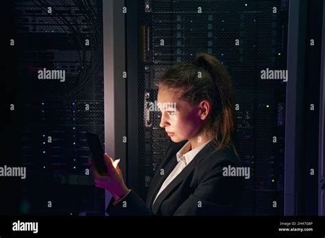 Woman Engineer Working In Data Center By Server Storage Racks Stock Photo Alamy
