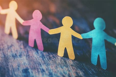 Colorful Paper Figures Hold Hands Symbolizing Unity Diversity And Collaboration In A Bright