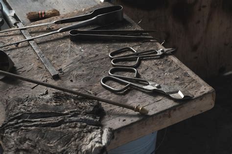 Premium Photo High Angle View Of Hand Tools On Table In Workshop