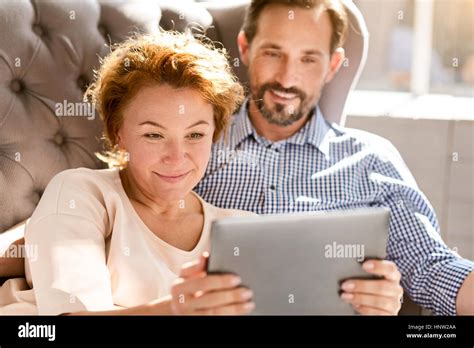 Glad Middle Aged Couple Having Fun At Home Stock Photo Alamy
