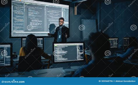 Teacher Giving Computer Science Lecture To Diverse Multiethnic Group Of Female And Male Babes