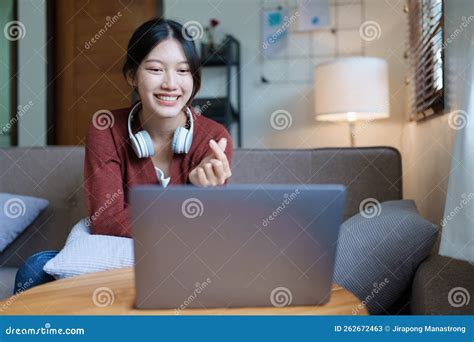 Portrait Of A Beautiful Asian Teenage Girl Using A Computer Stock Image