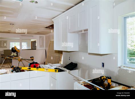 Custom Kitchen Cabinets In Various Stages Of Installation Base For