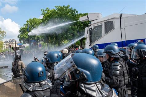French Police Water Cannon Hosing Down Demonstrators At The End Of A