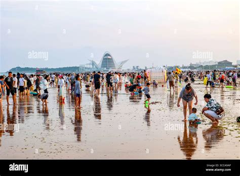 Tourists Visit The Jinshatan Bathing Beach In Qingdao City East China