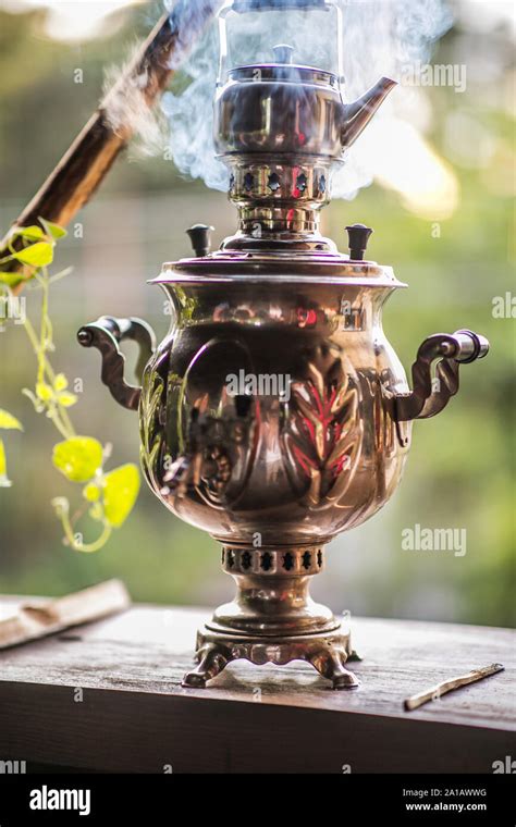 Traditional old metal russian samovar. Tea time Stock Photo - Alamy