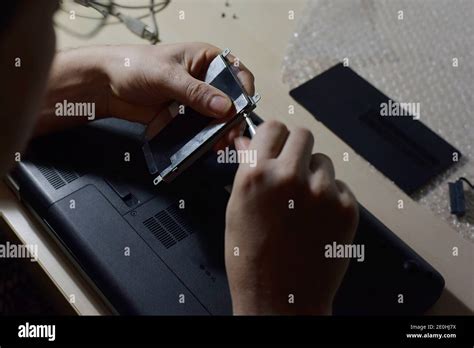 Man Replacing Hard Drive On Laptop Stock Photo Alamy