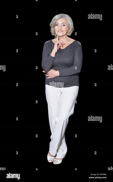 Full Length Portrait Of Senior Woman Posing On Black Background Stock Photo Alamy