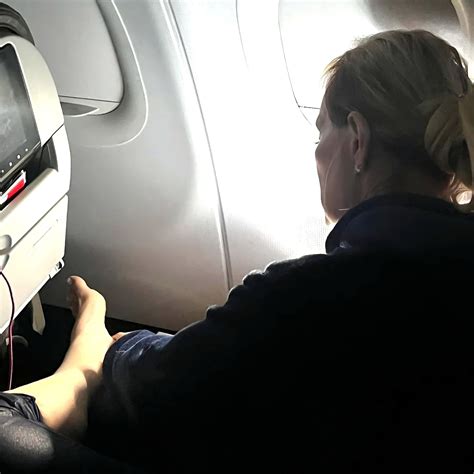 American Airlines Passenger Spends Flight Grinding Dead Skin Off Her