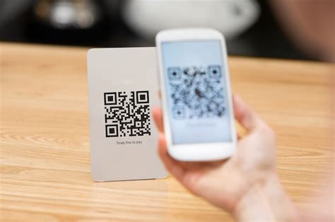 Premium Photo Closeup Of A Hand Holding Phone And Scanning Qr Code