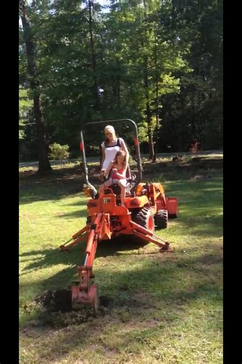 Tori Driving The Tractor Outdoor Power Equipment Tractors Outdoor